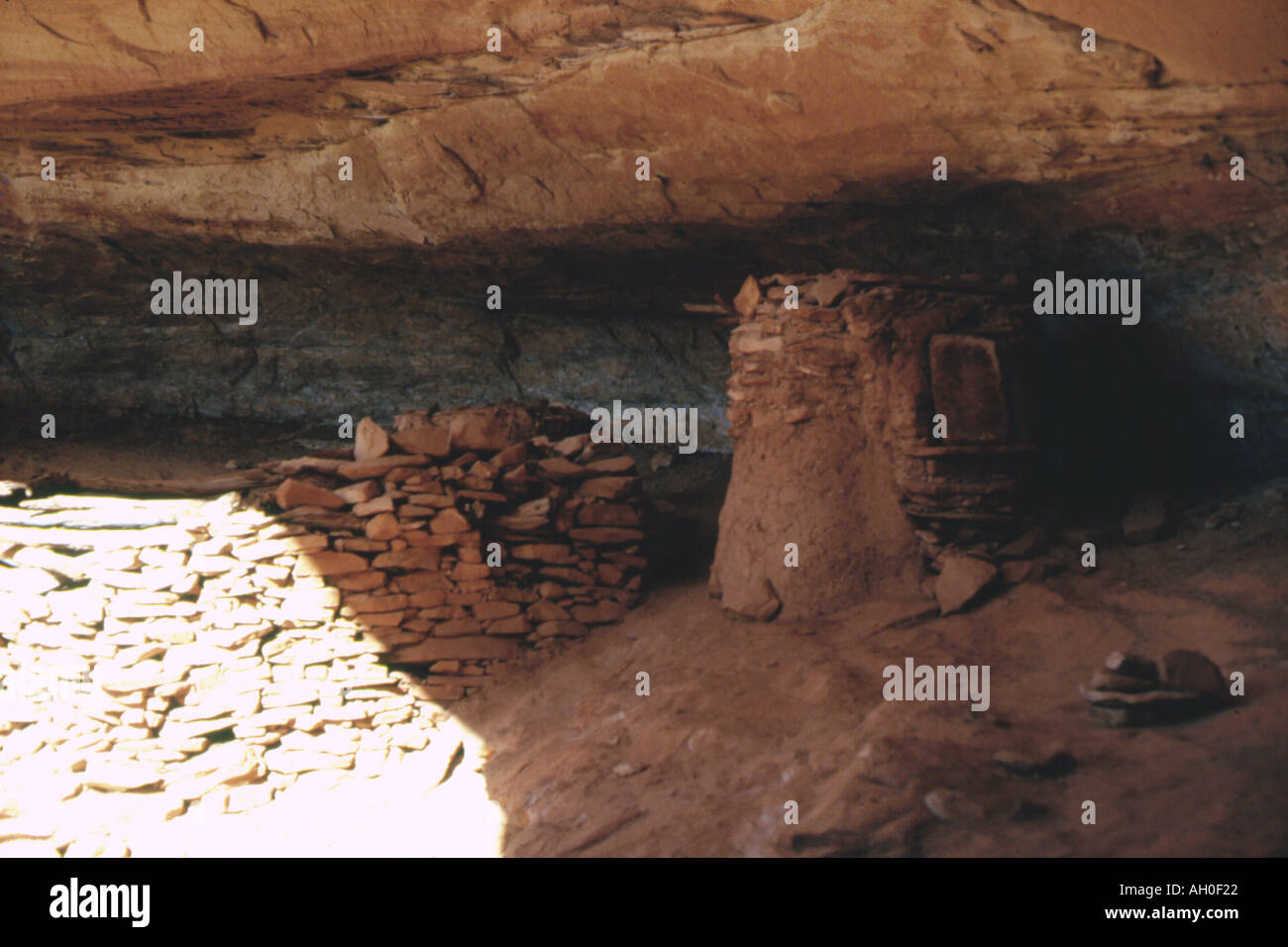 Ancient Anasazi kiva and granary, nestled in a cliff-side overhang in ...