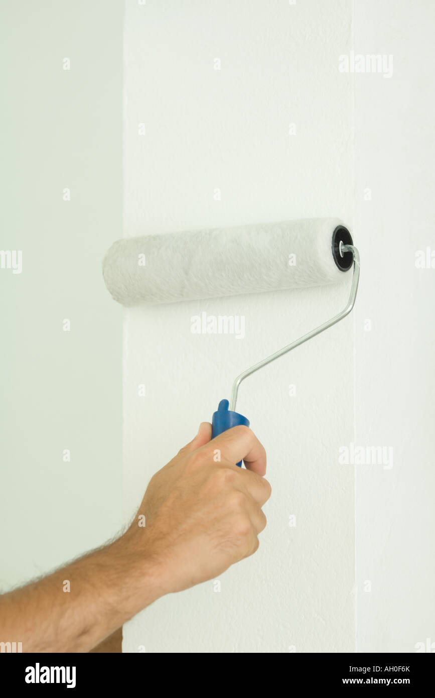 Paint rollers hands hi-res stock photography and images - Alamy