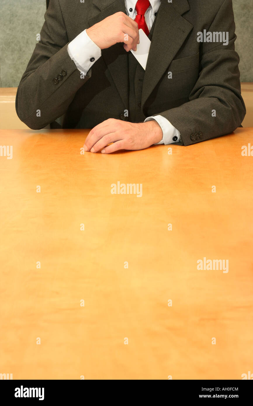 Business man sitting at the desk introducing himself Stock Photo - Alamy
