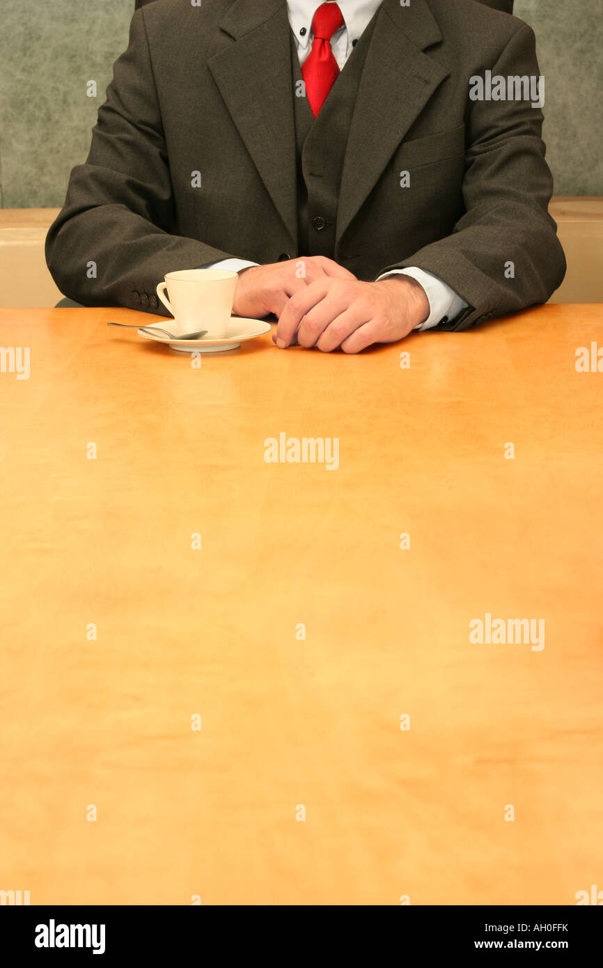 Business man waiting at the desk cup of coffee Stock Photo - Alamy