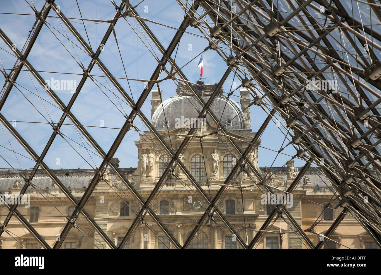 View of the Palais du Louvre through the glass pyramid, Paris Stock ...