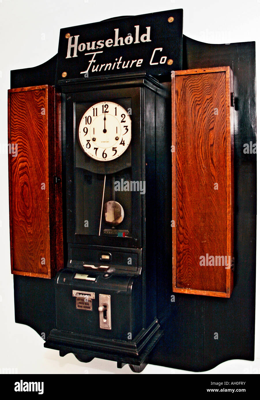 Old time clock where employees "clock in" to record time the employees ...