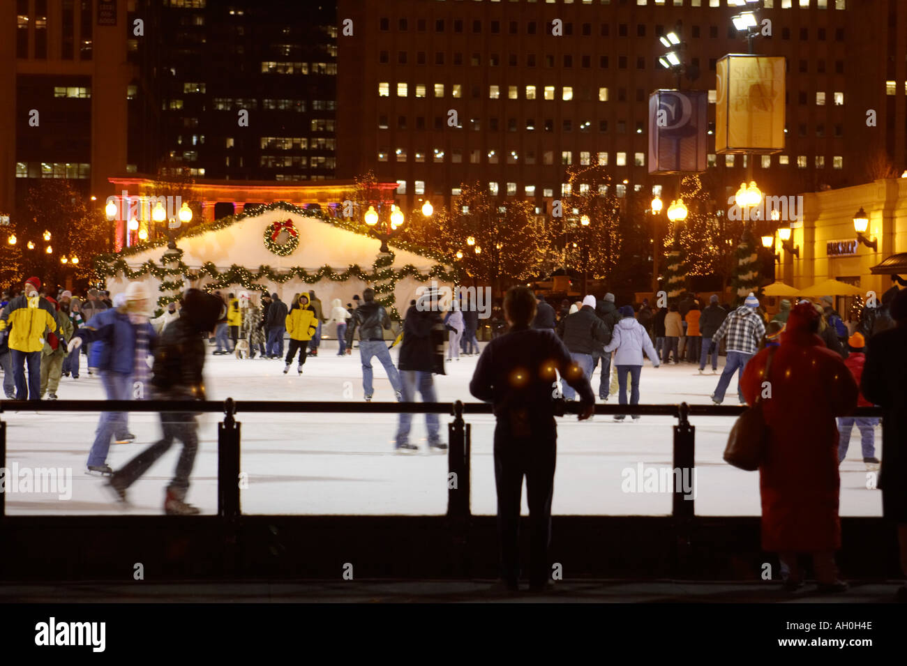 SKATING Chicago Illinois Ice skaters at Millennium Park ice rink winter ...