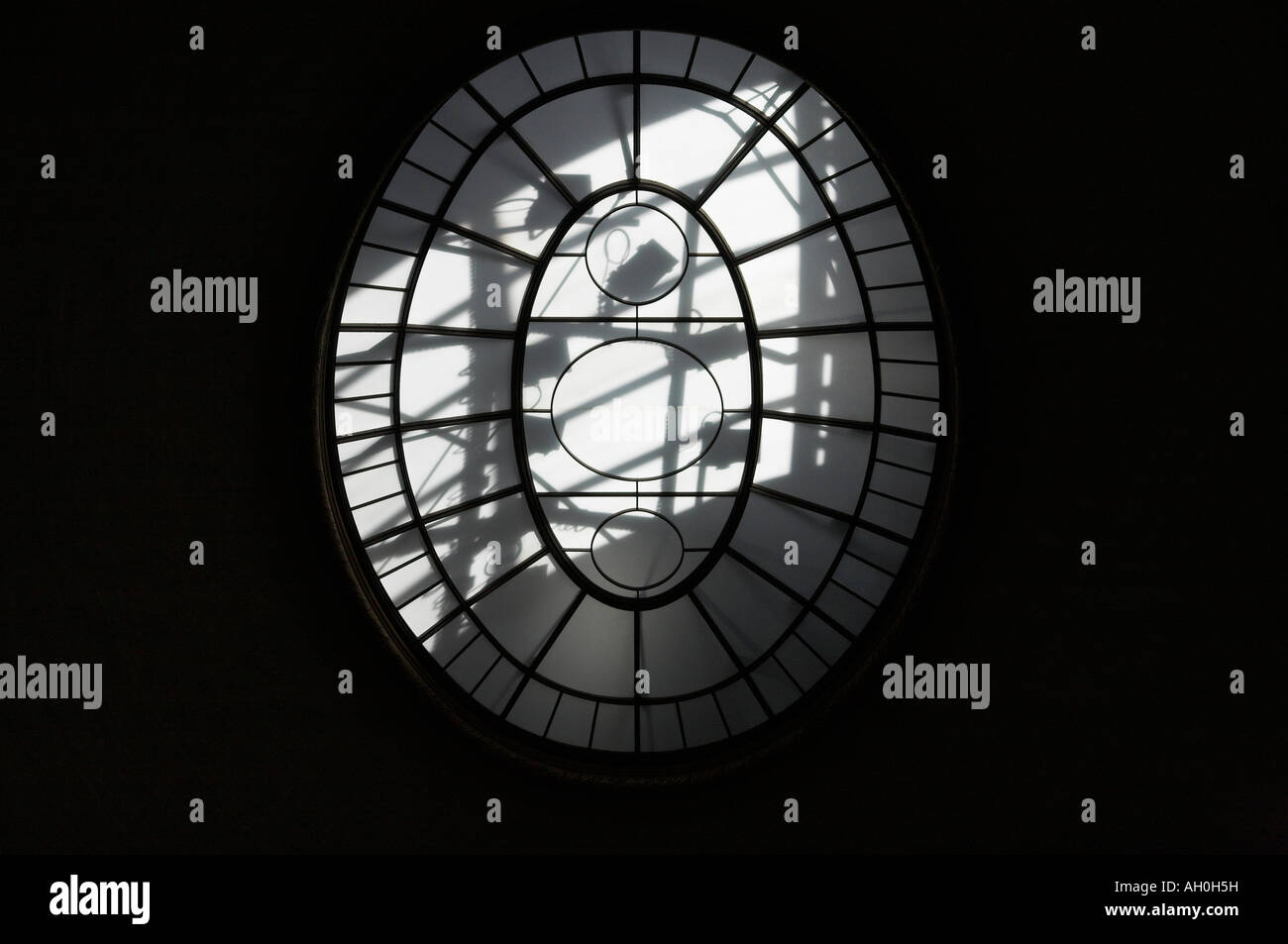 Oval ceiling window with lights in silhouette Stock Photo - Alamy