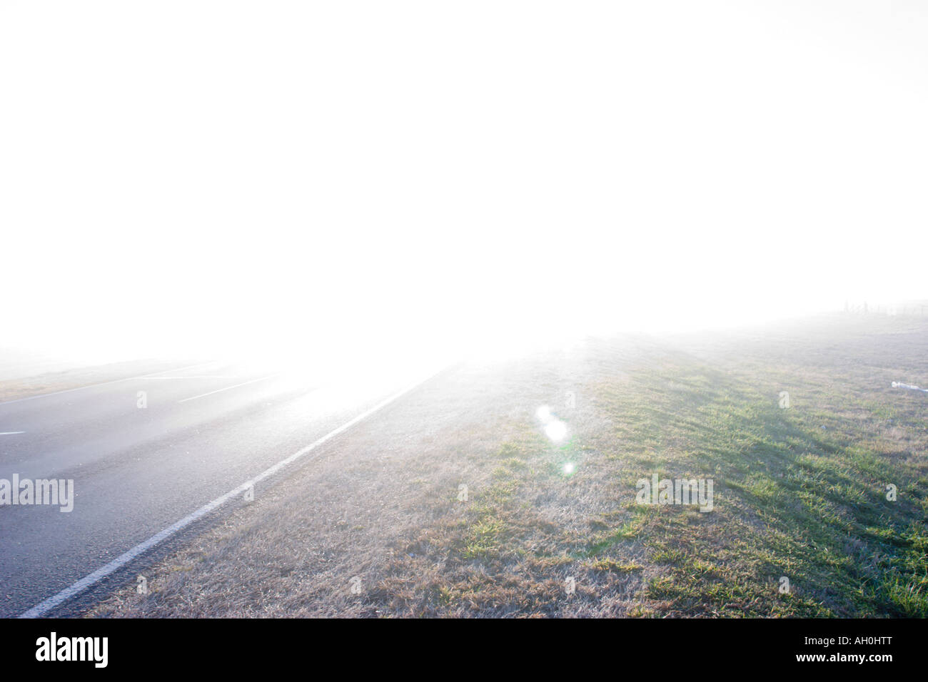 Dense mist in a road Stock Photo - Alamy