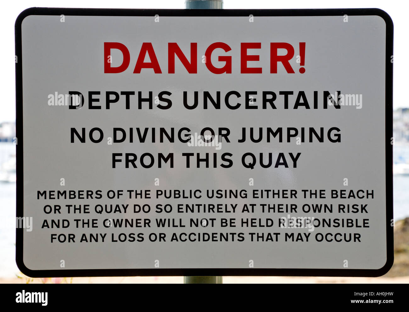 Danger sign. No diving from this quay Stock Photo - Alamy