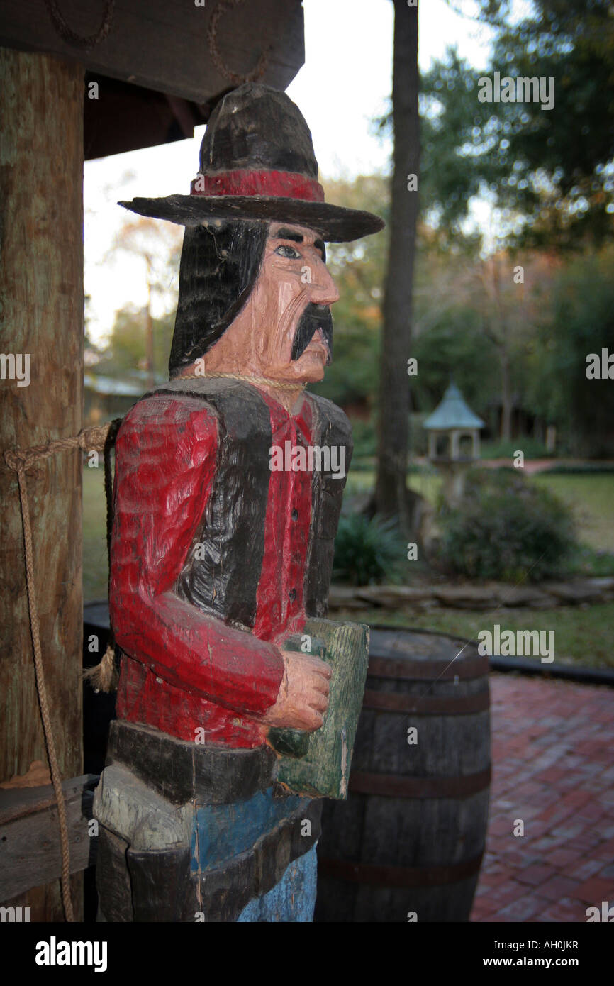Carved Wooden Cowboy at Bar Stock Photo - Alamy