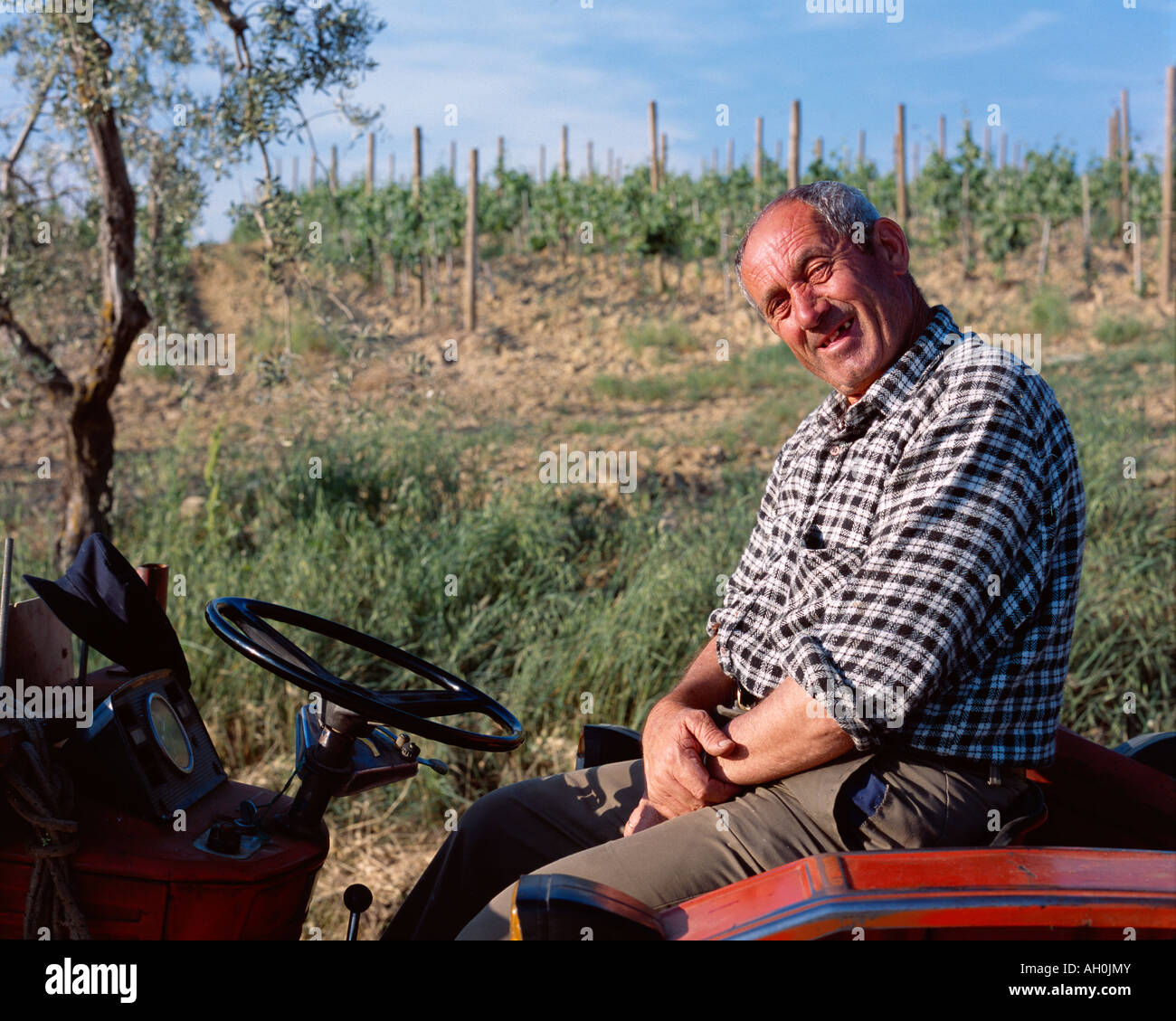 Italian farmer on tractor Stock Photo - Alamy