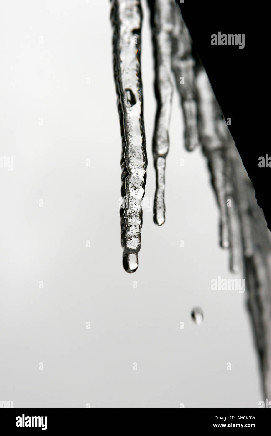 Frozen icicles hanging from house from winter storm Stock Photo - Alamy