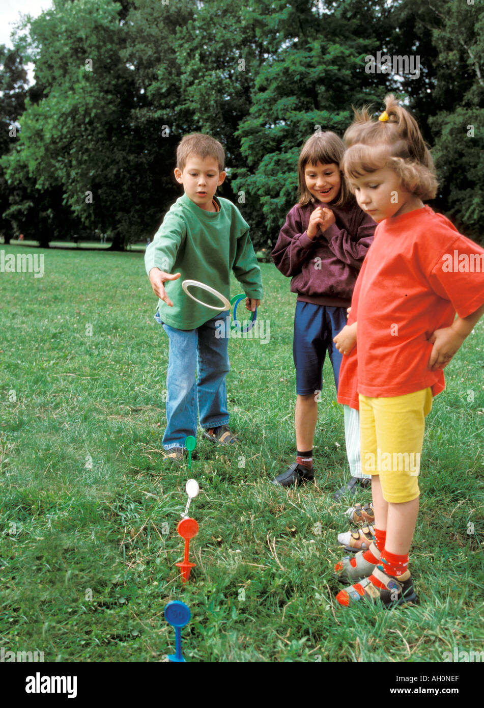 children playing with circles Stock Photo - Alamy