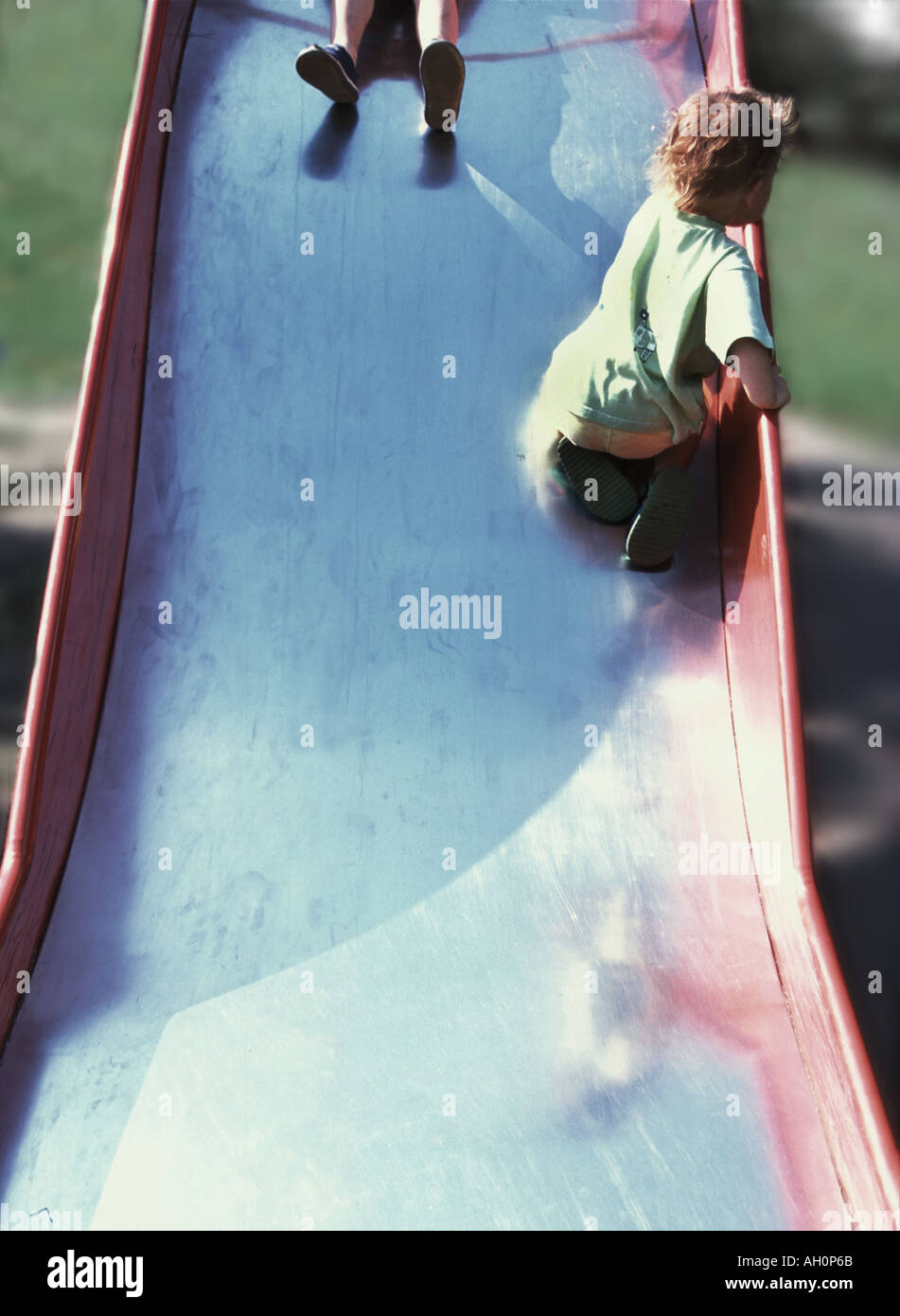 child on slide MR8408 Stock Photo - Alamy