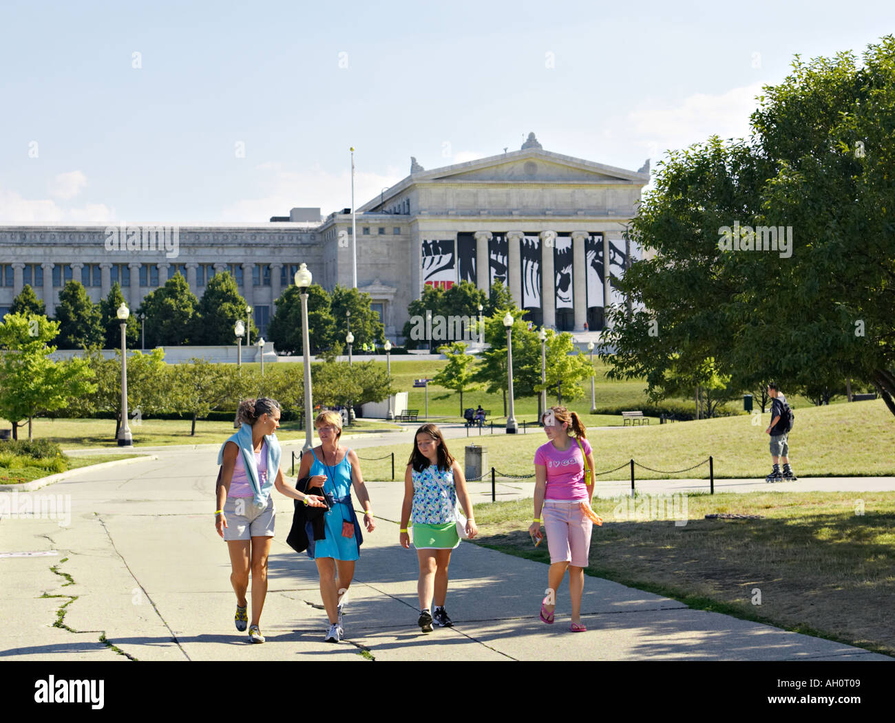 MUSEUMS Chicago Illinois Two women and two young girls walk sidewalk ...