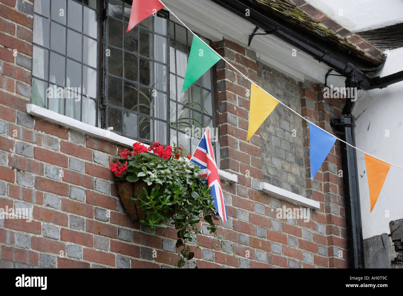 Bunting and Union flag on English house Stock Photo - Alamy