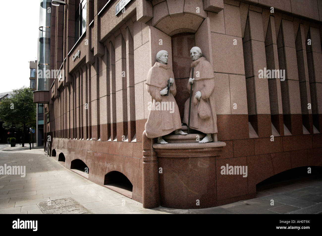 Statues of two monks on Crutched Friars, the City, London, England, UK ...