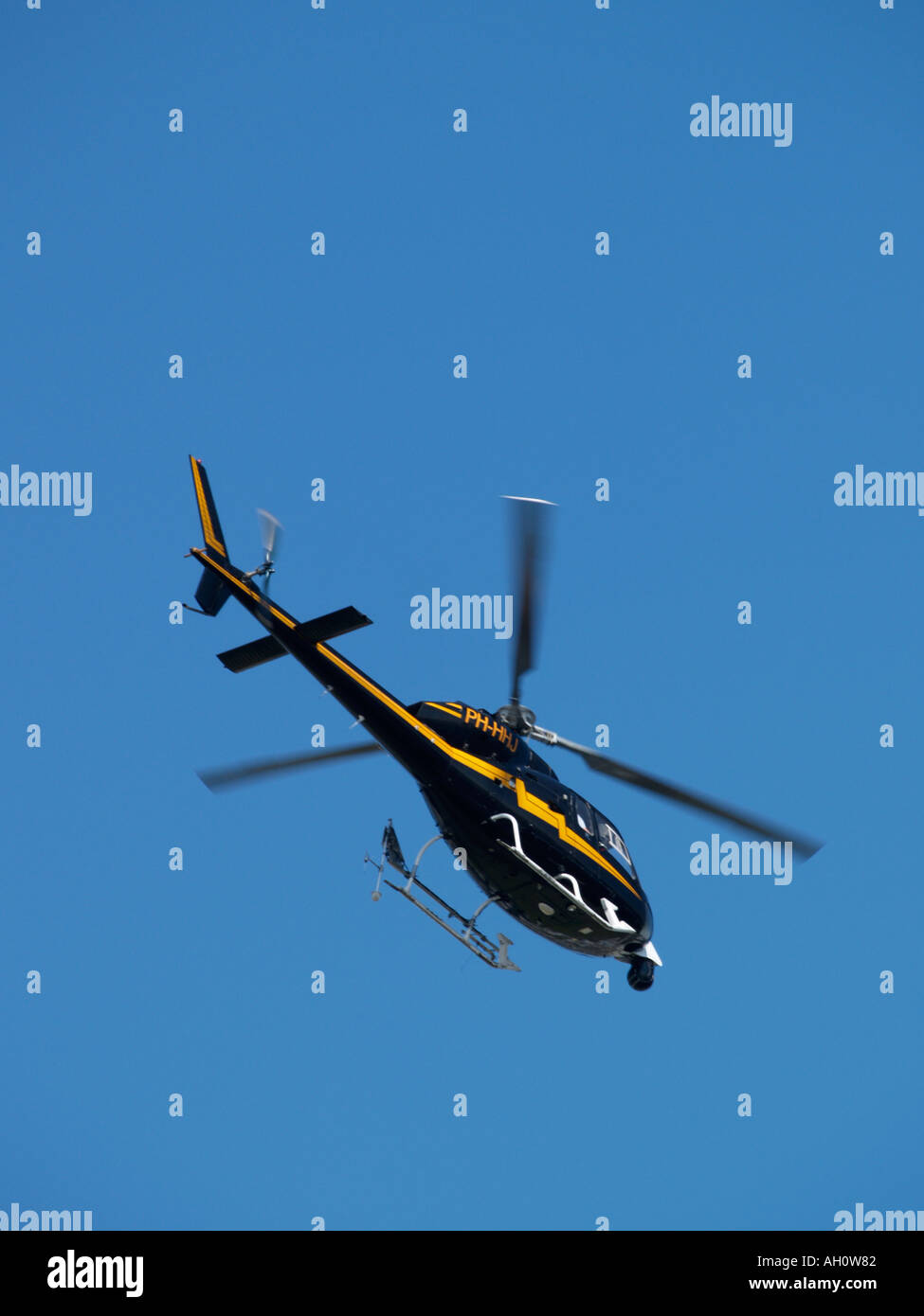 Dutch surveillance helicopter equipped with camera flying above the ...