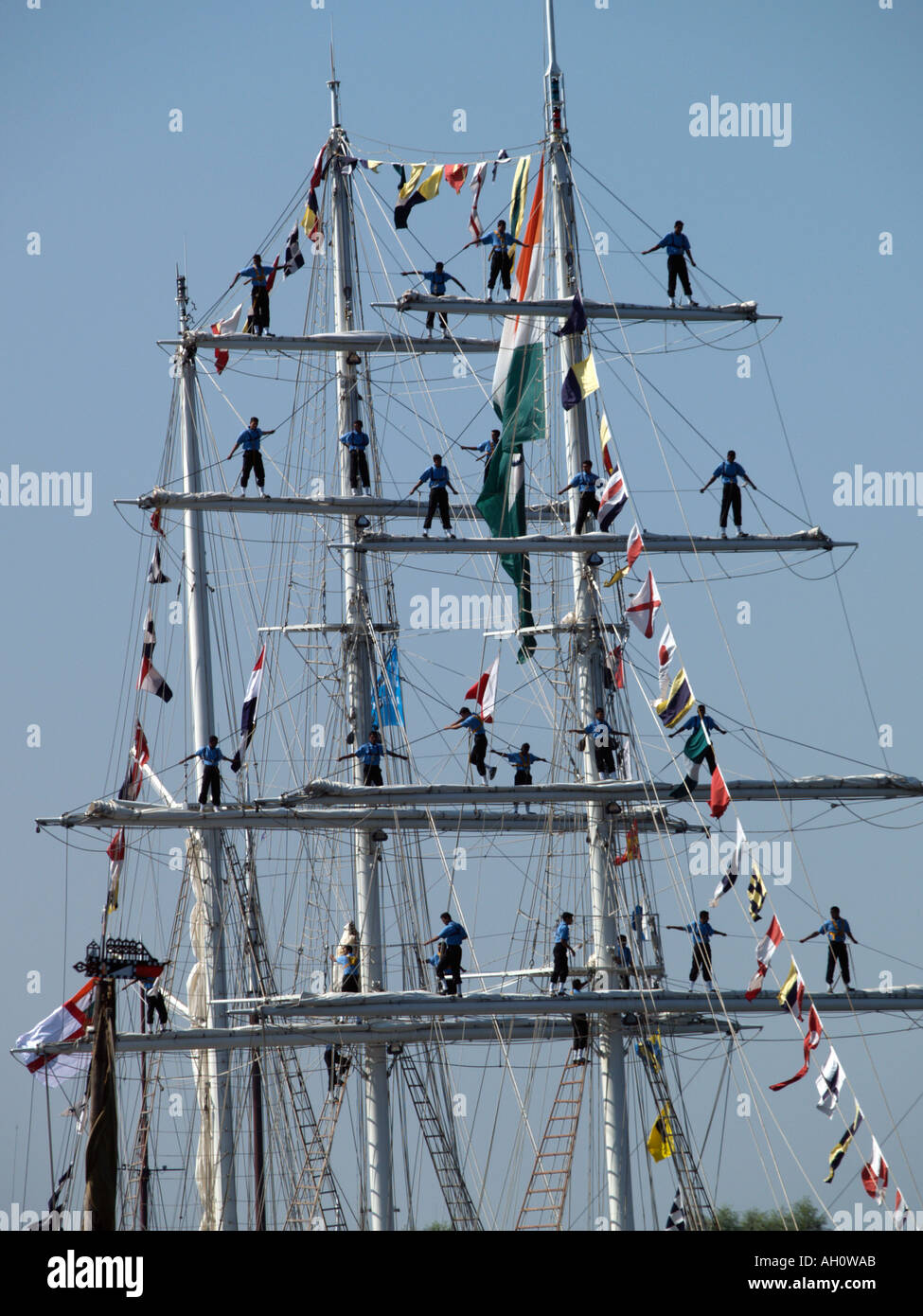 Masts and yards of the Indian tall ship INS Tarangini with sailors ...