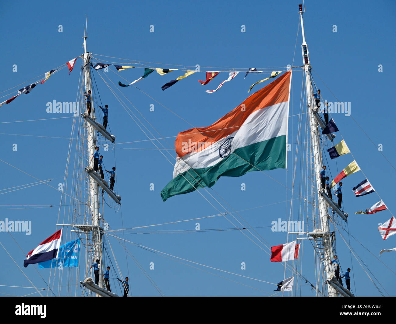 Masts and yards of the Indian tall ship INS Tarangini with sailors ...