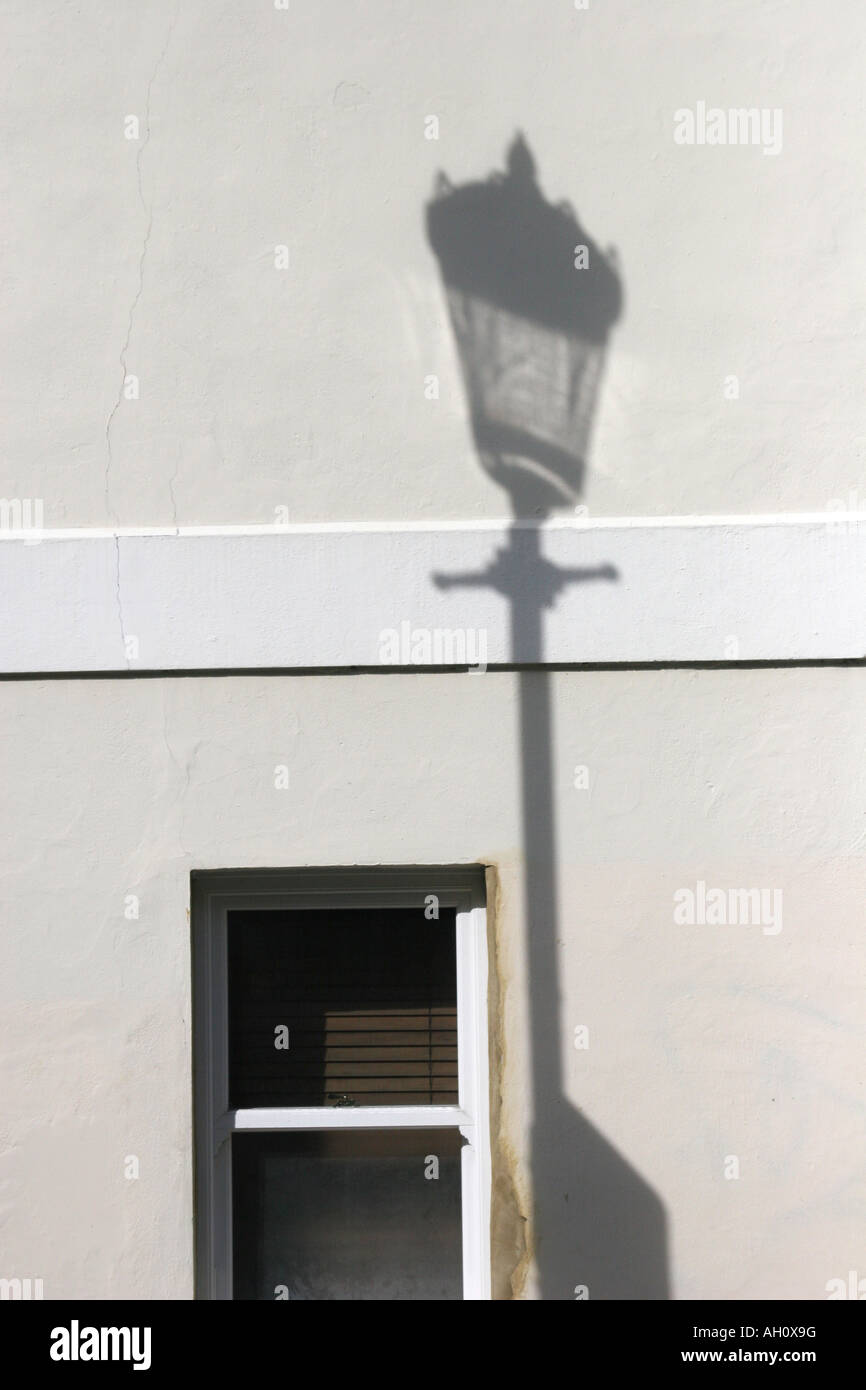 Shadow of lamp over building Stock Photo - Alamy