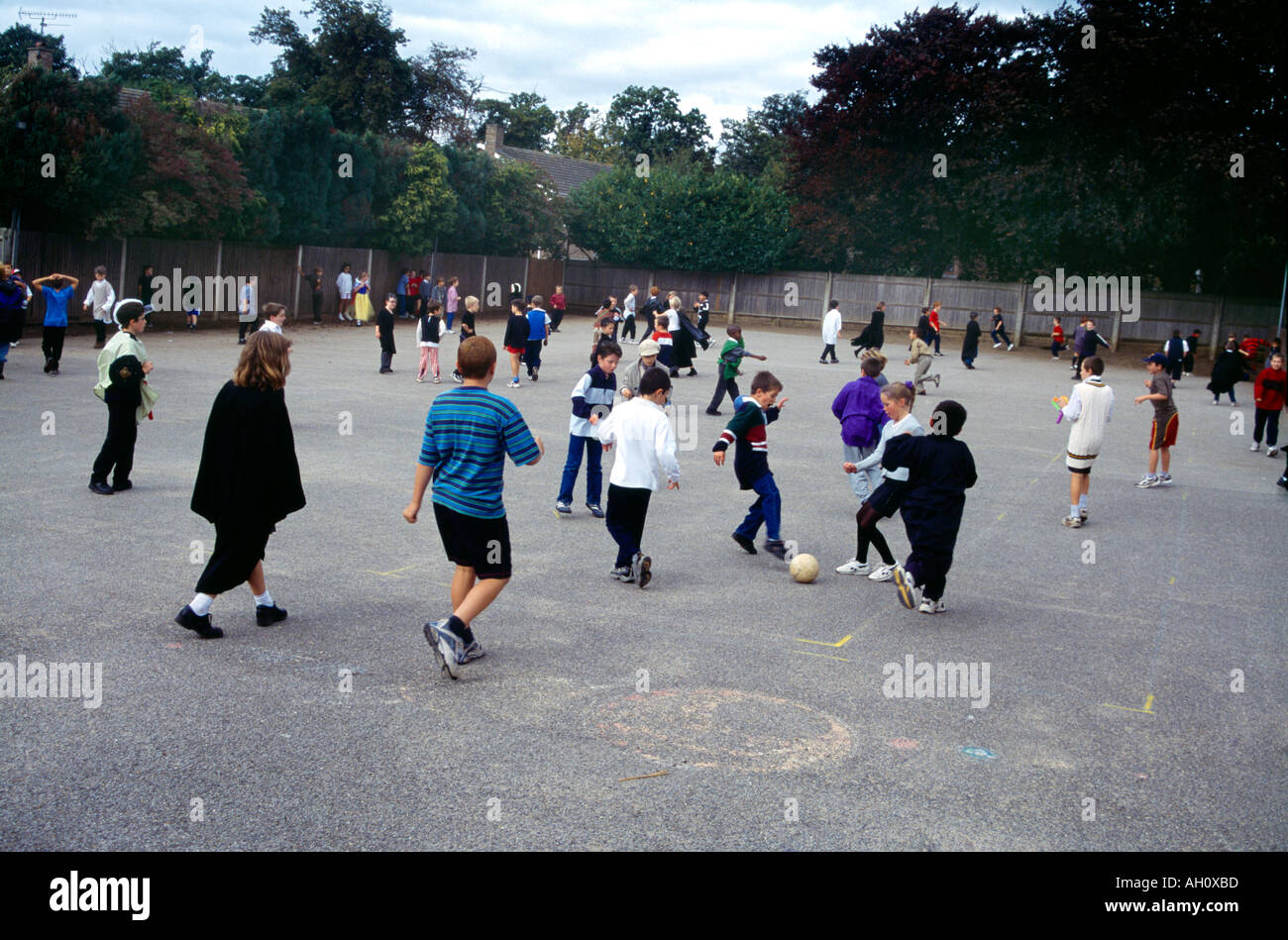 Children Playing Football In School Playground Multi Race Stock Photo ...
