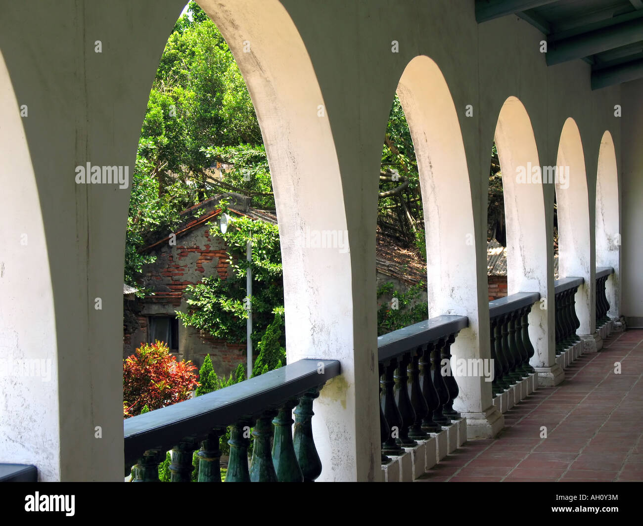 Colonial Architecture -- a roofed porch that has arched columns Stock ...