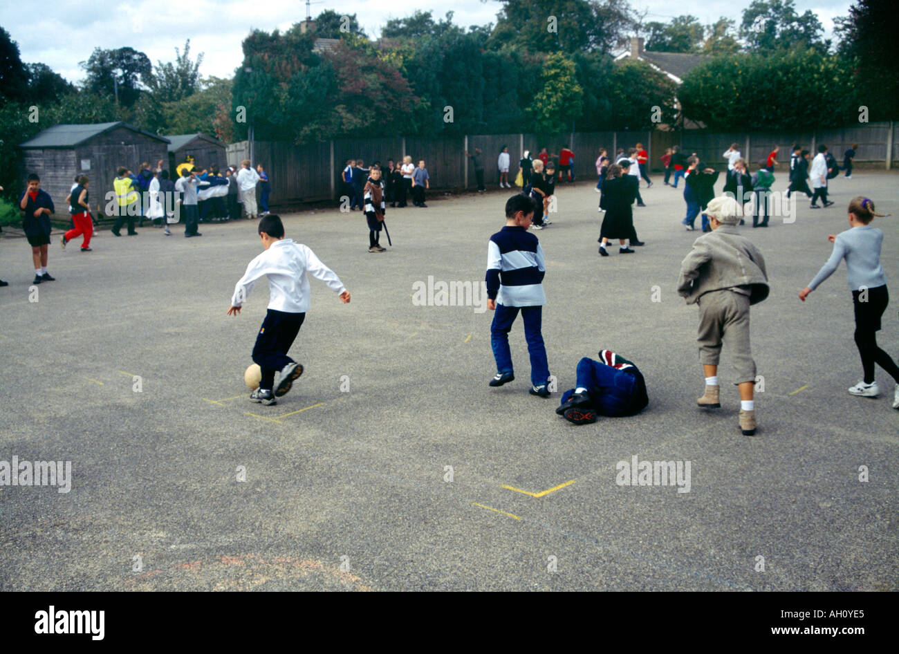 Children Playing Football In School Playground Multi Race Stock Photo ...