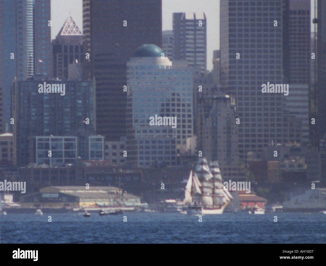 Tall ship on the Seattle waterfront with city skyline in the background ...