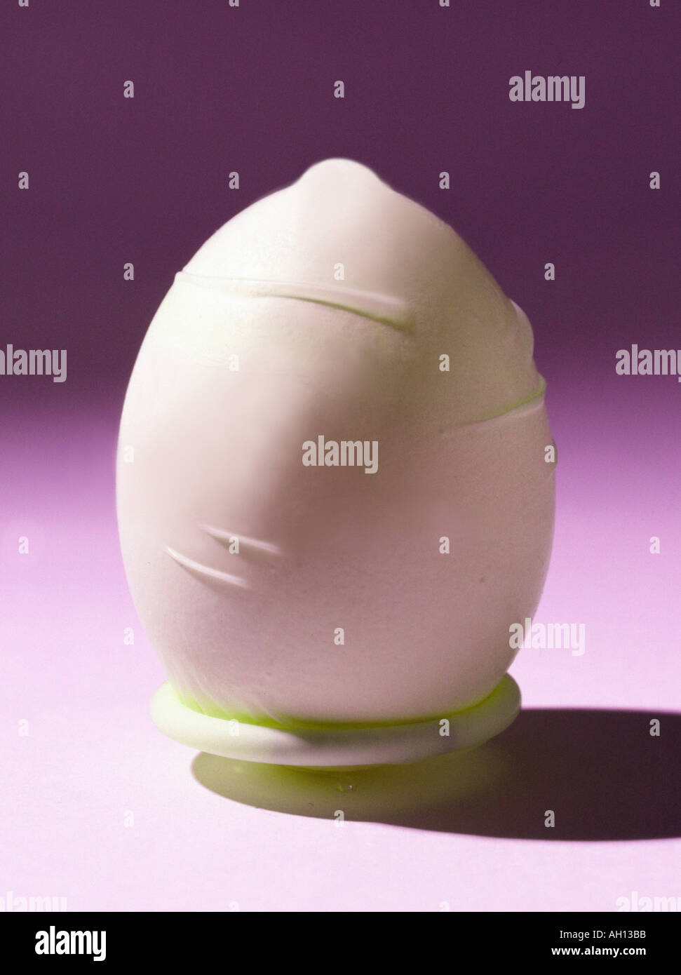 Condom on egg Stock Photo - Alamy