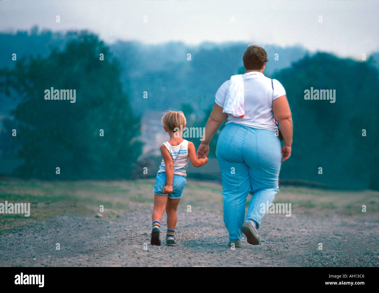 Fat lady and boy Stock Photo - Alamy