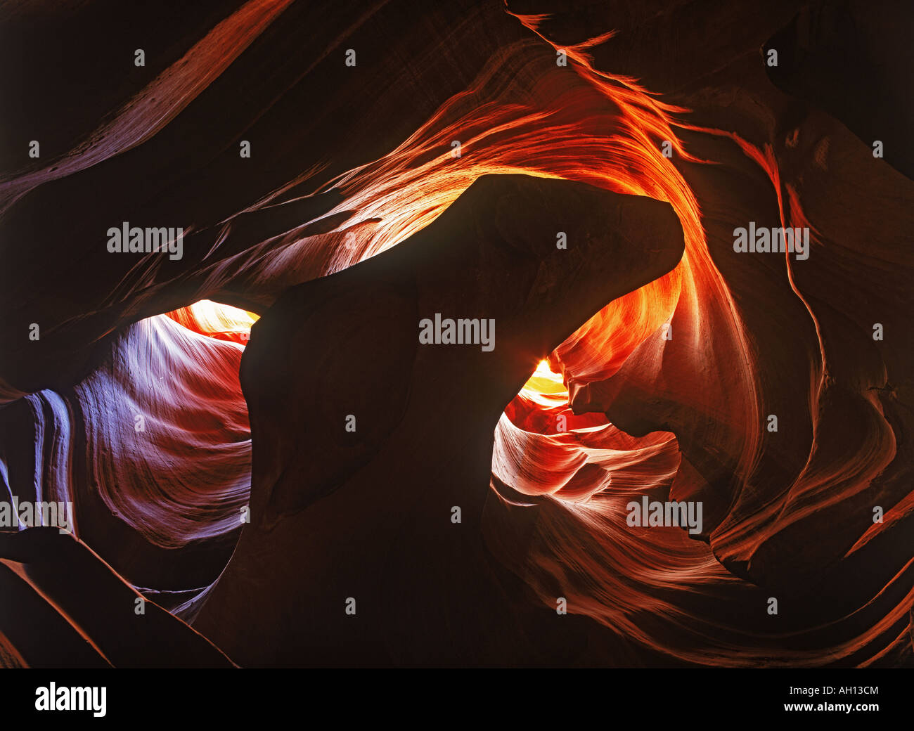 Light seeping through sandstone rock formations in Antelope Canyon near ...