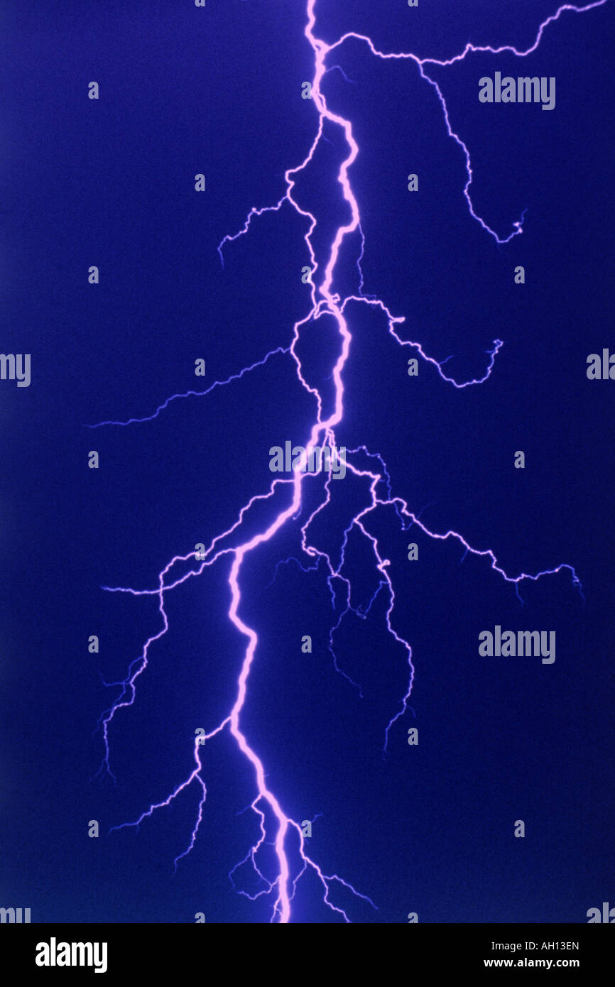 Lightning bolt slicing night sky Stock Photo - Alamy