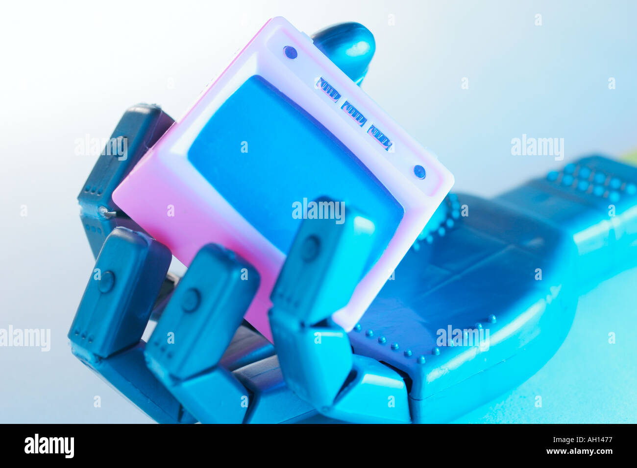 Robot Hand Holding Toy TV Stock Photo - Alamy
