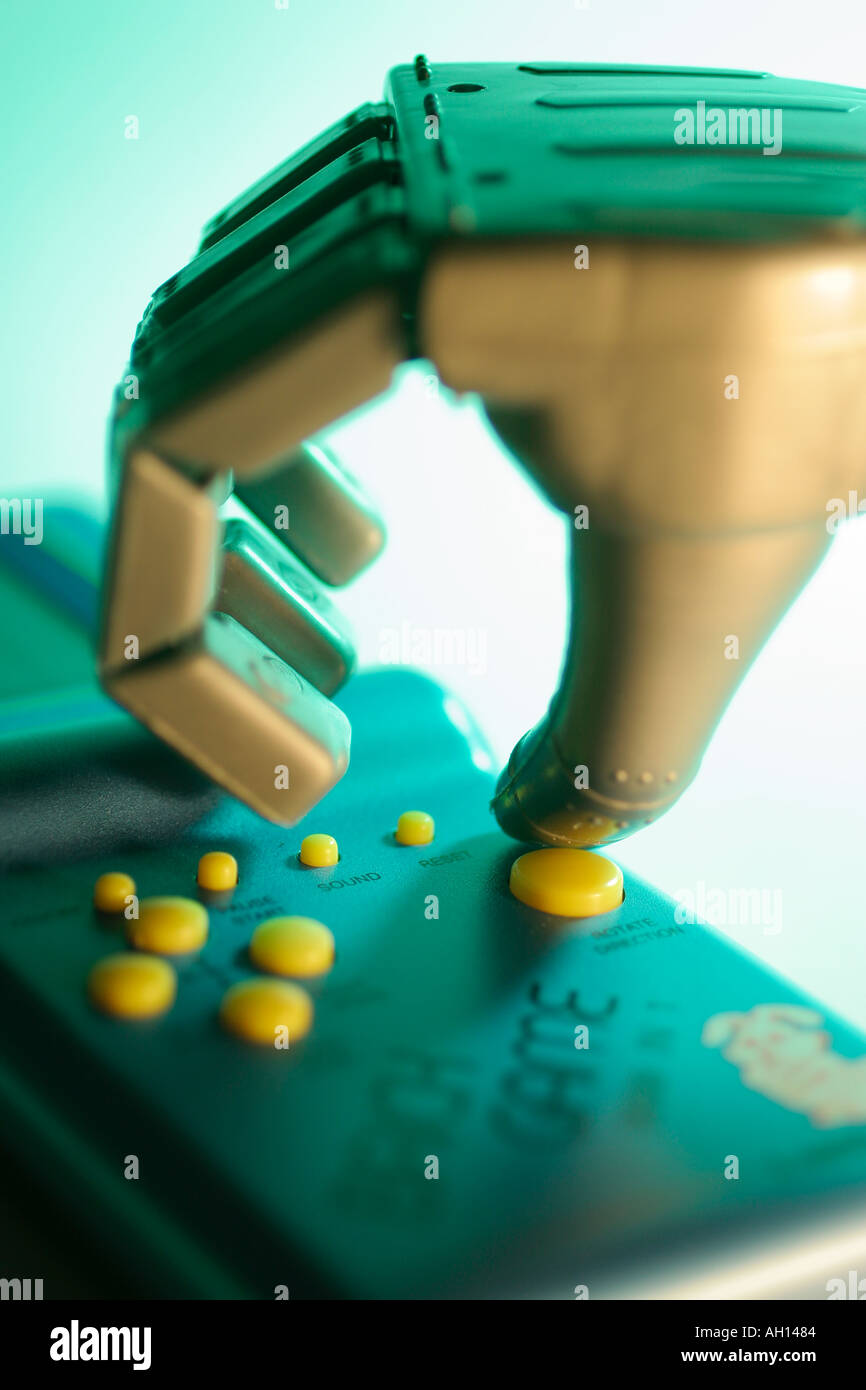 Robot Hand and Pocket Game Stock Photo - Alamy
