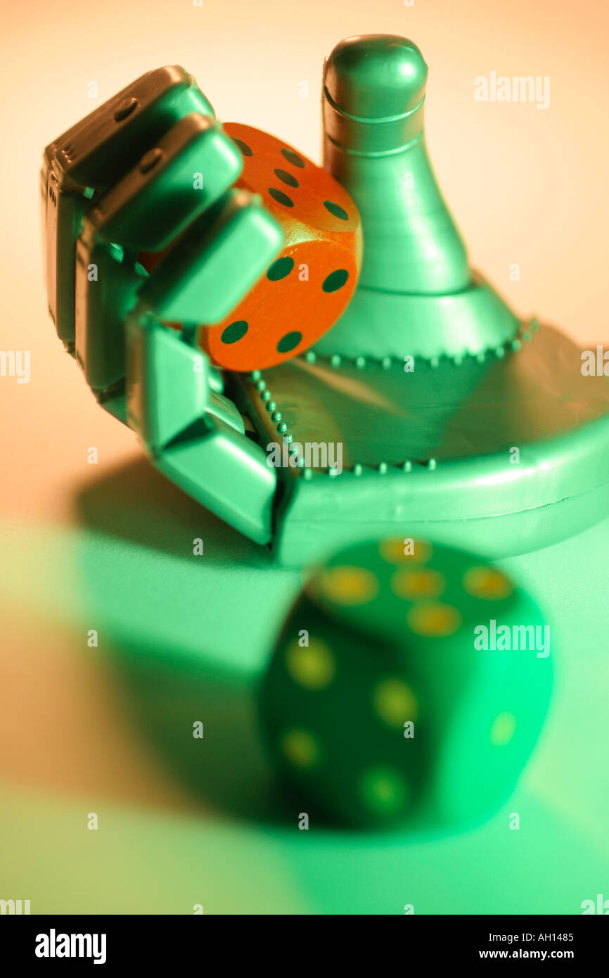 Robot Hand with Dice Stock Photo - Alamy