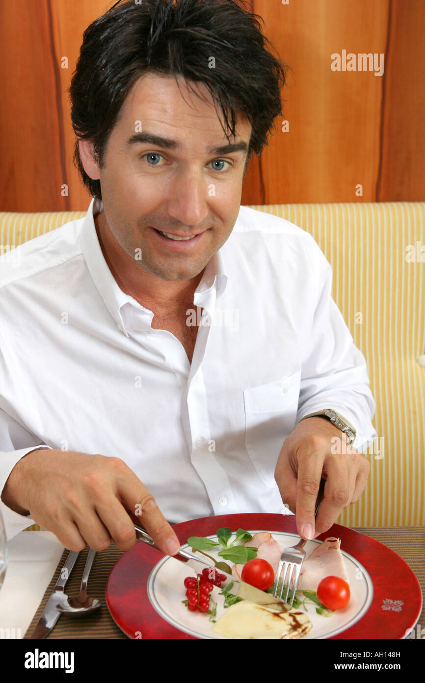 Adult eating food with bib hi-res stock photography and images - Alamy