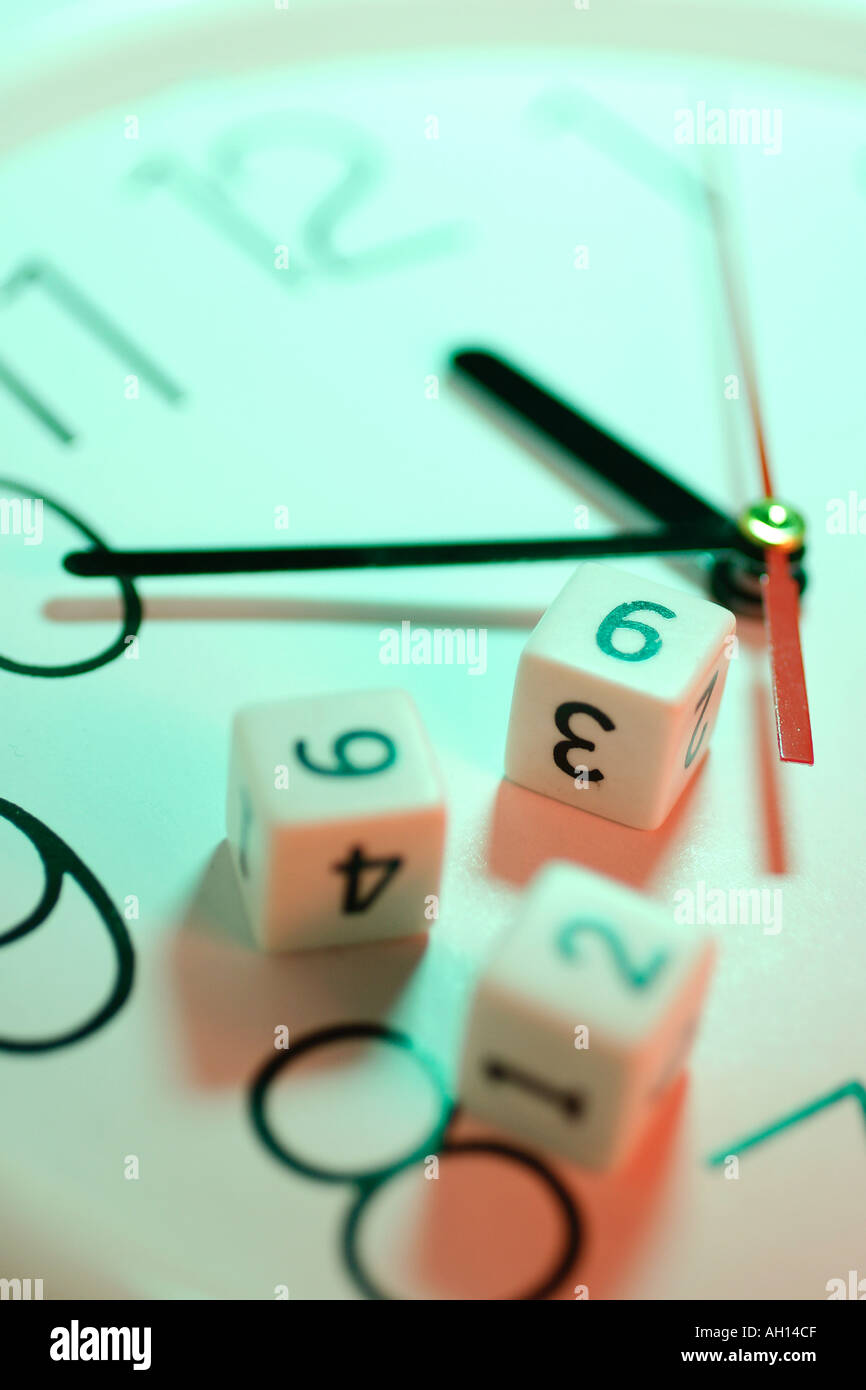 Dice on Clock Stock Photo - Alamy