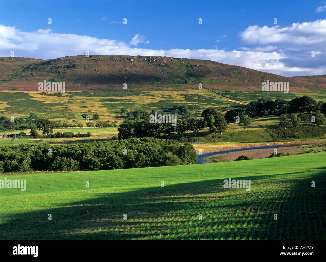 The Simonside Hills stand over the River Coquet in Northumberland ...