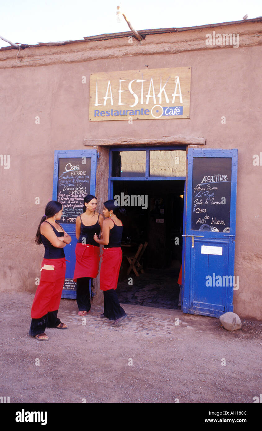 Three waitress standing outside a restaurant in the desert town San ...