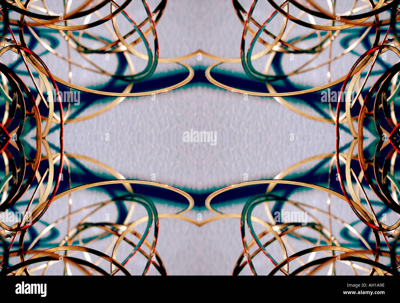 brown design taken from a bend out of shape metal slinky Stock Photo ...