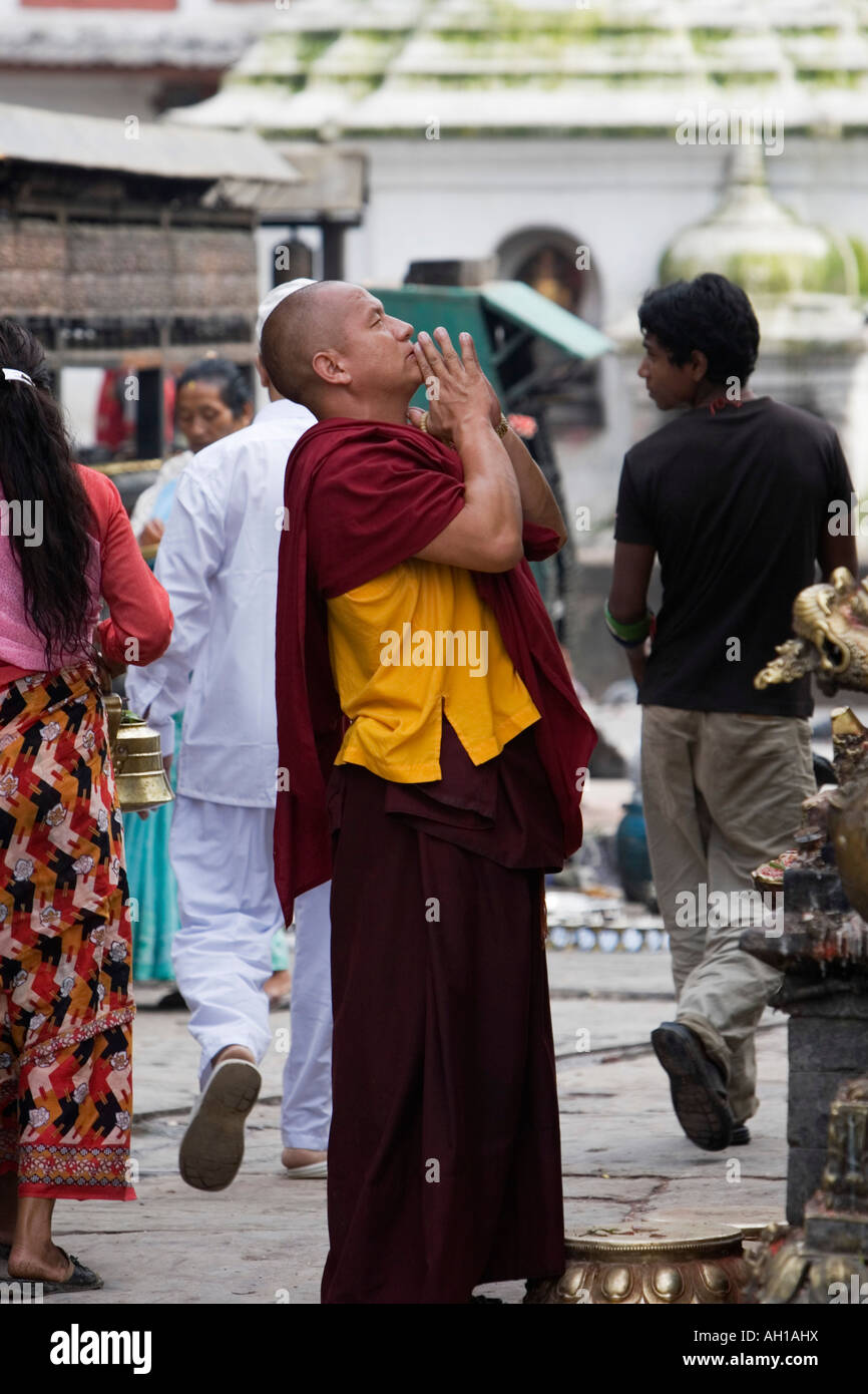 Tibetan buddhist monk praying at Swayambhu stupa, Nepal, Kathmandu ...