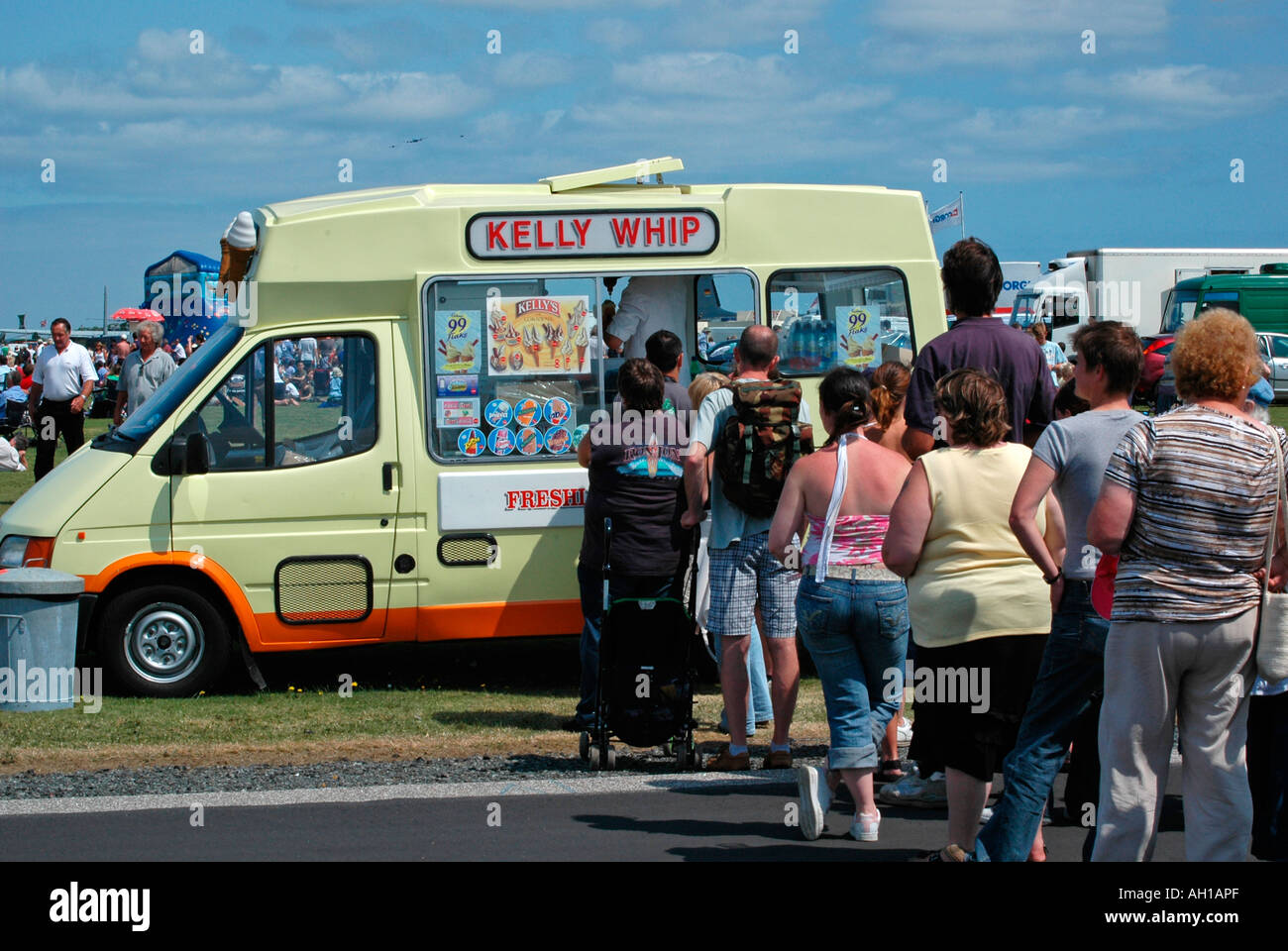 customers waiting in line to be served at an ice cream van in cornwall ...