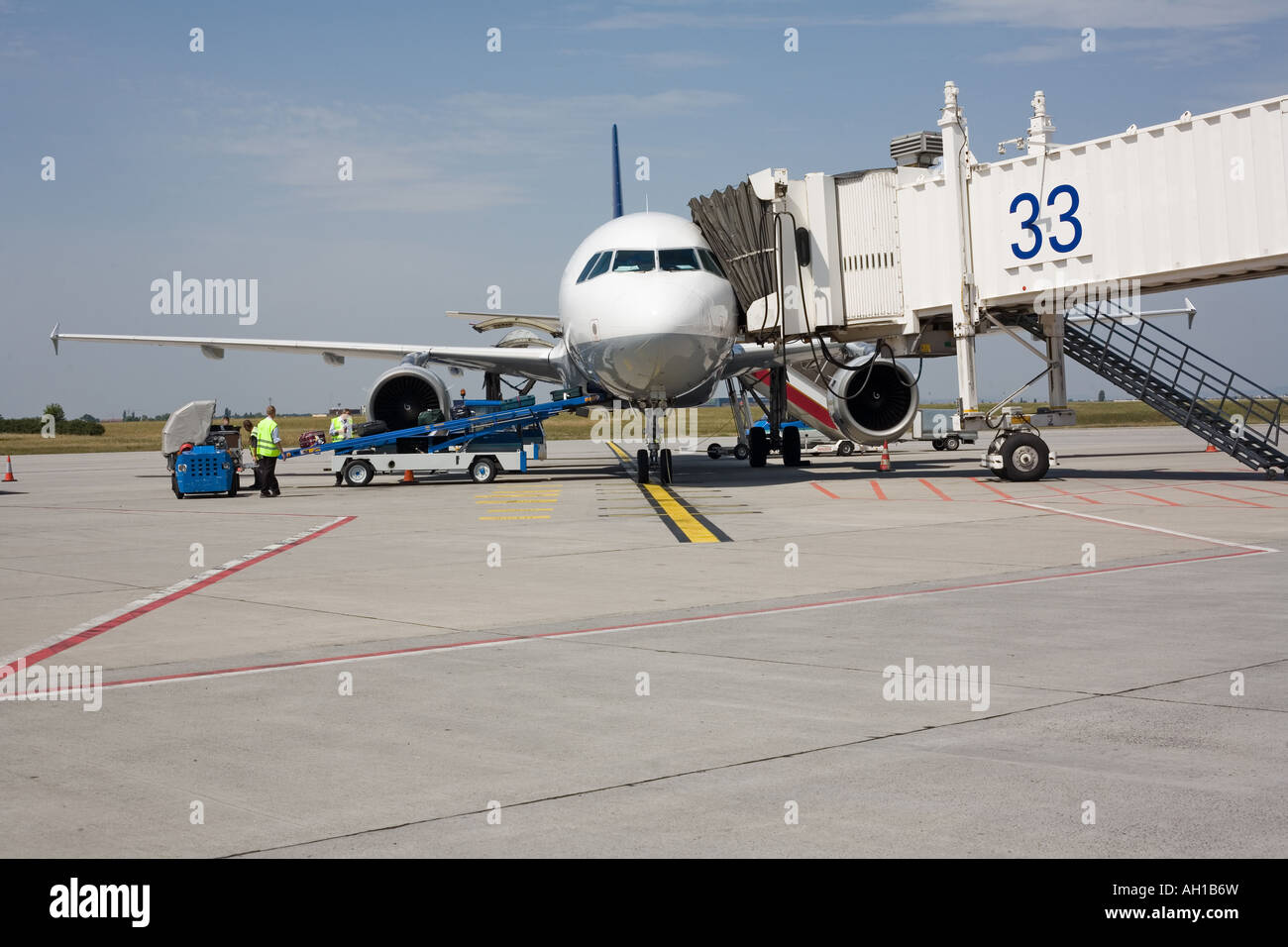 aircraft on the ground getting loaded Stock Photo - Alamy