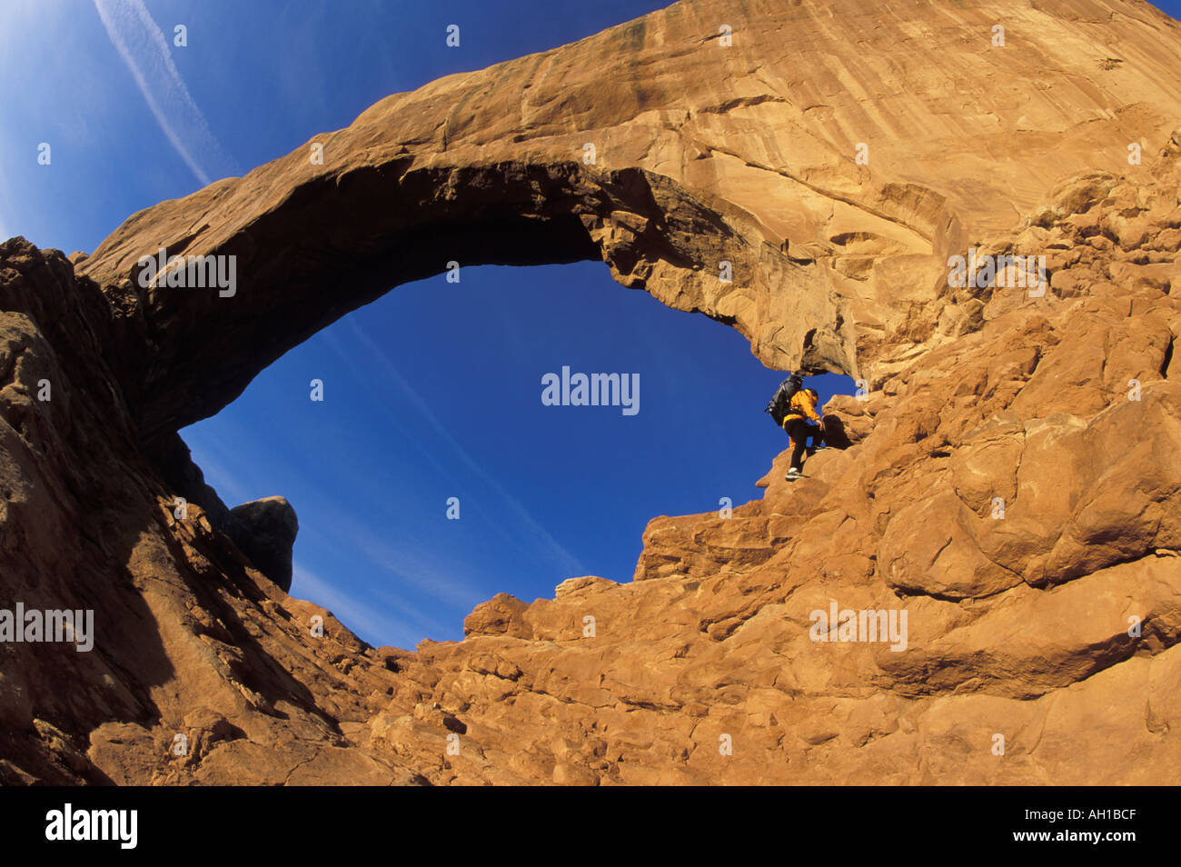Male hiker climbing arch hi-res stock photography and images - Alamy