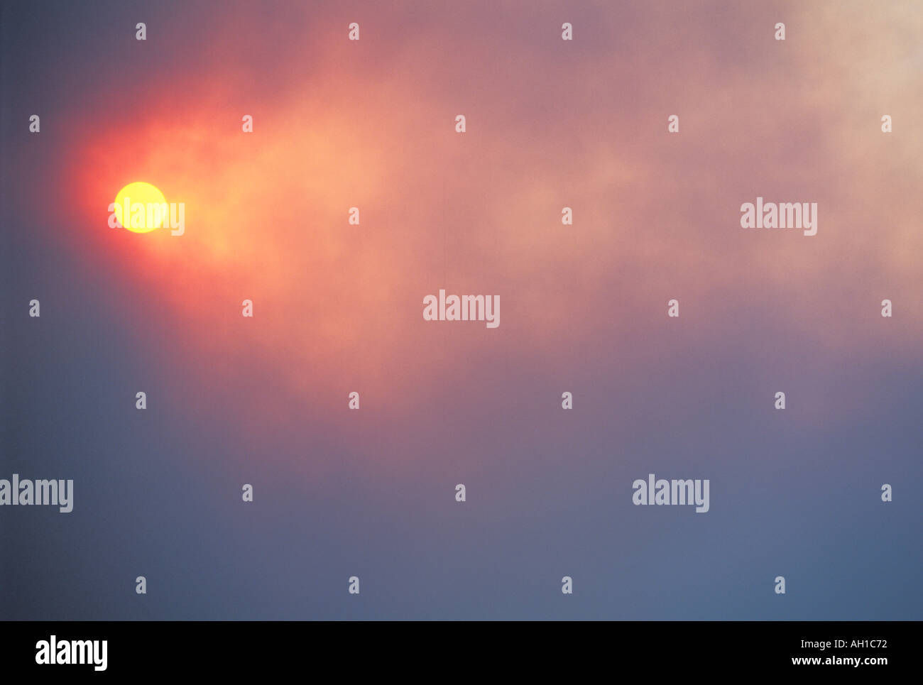 The sun viewed through dense smoke from a nearby forst fire Stock Photo ...
