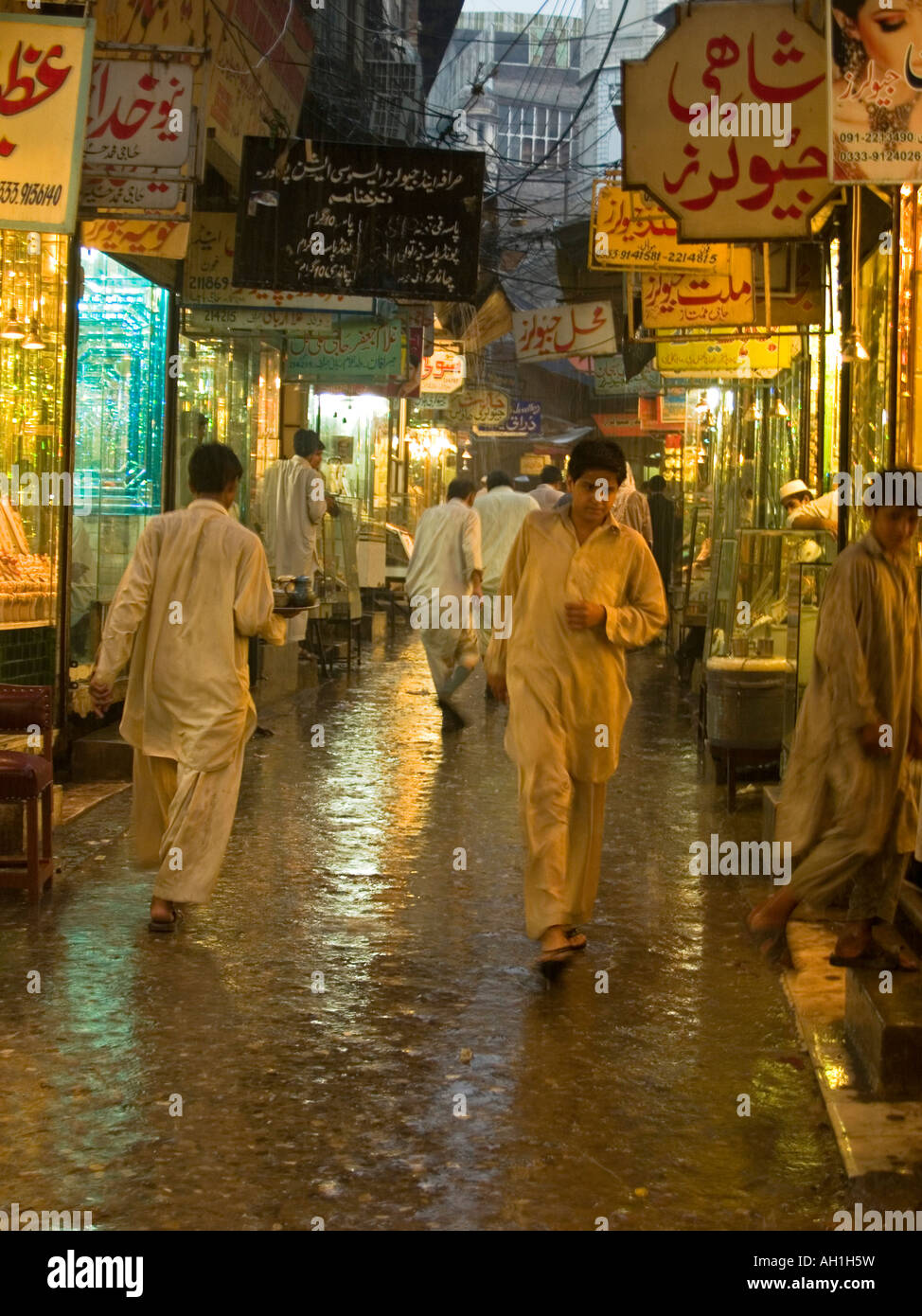 rushing through the gold bazaar of Peshawar Pakistan in the rain Stock ...
