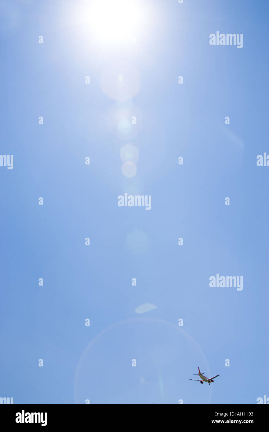 Jet plane and the sun Stock Photo - Alamy