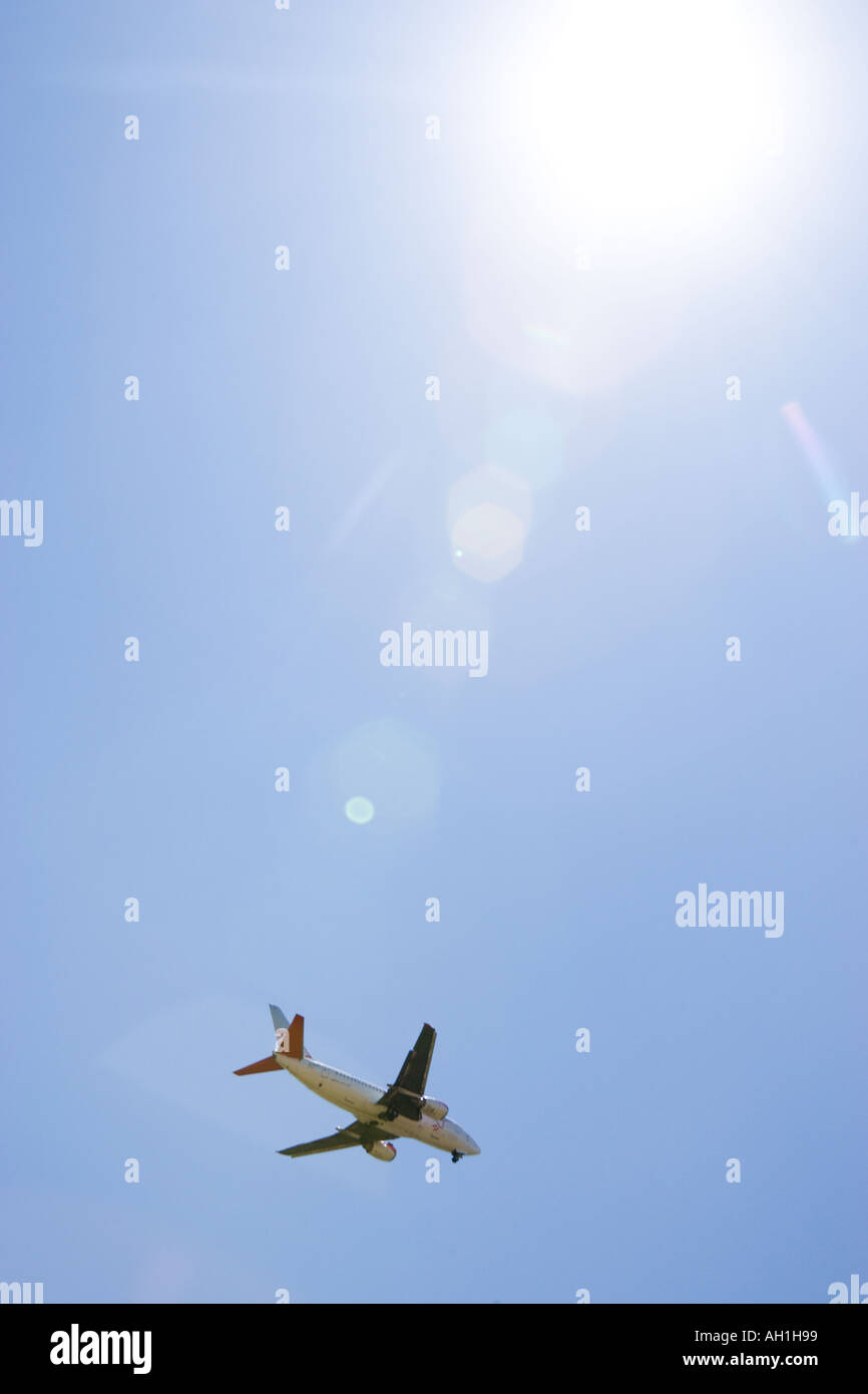 Jet plane and the sun Stock Photo - Alamy