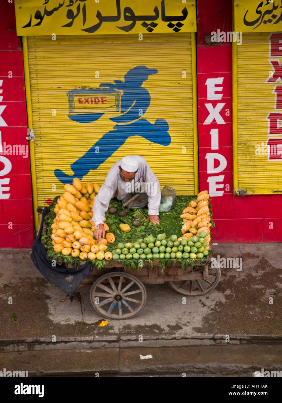 a mango seller arranges his fruit Peshawar Pakistan Stock Photo - Alamy