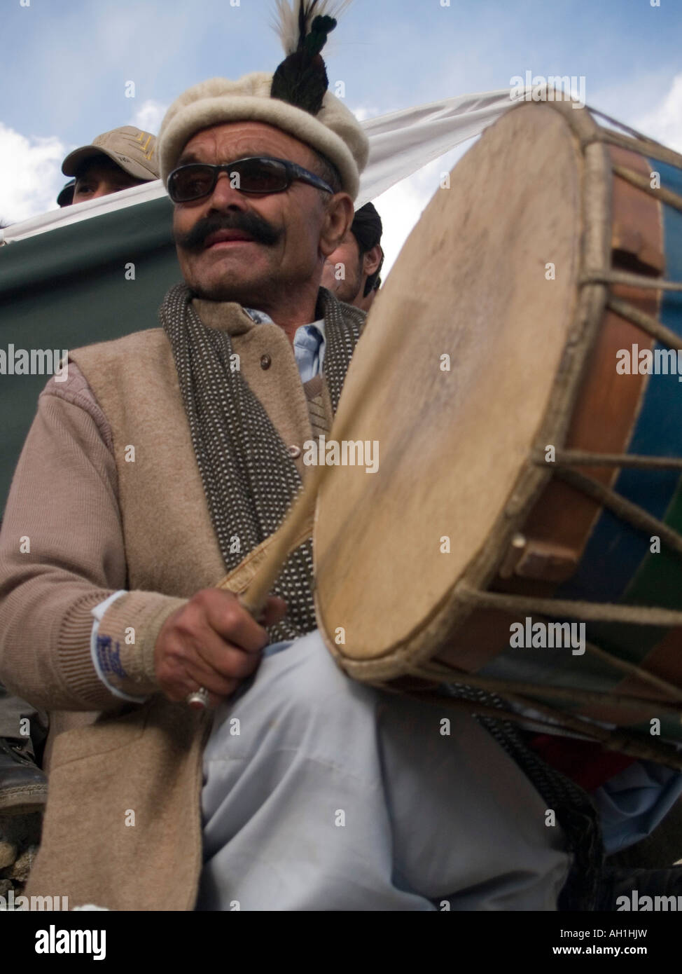 musician playing his drum at the Shandur Pass Polo Festival Pakistan ...