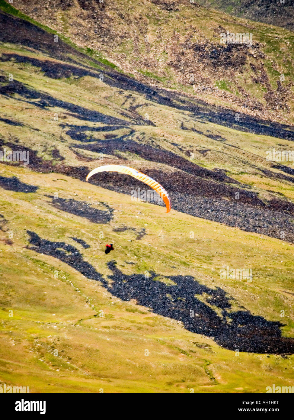 parasailer descends to the Shandur Pass in the Hindu Kush Pakistan ...