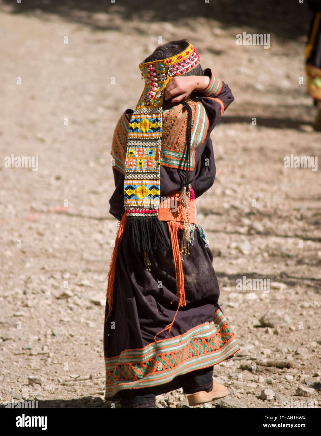 shy Kalasha girl and her traditional headdress, Pakistan Stock Photo ...